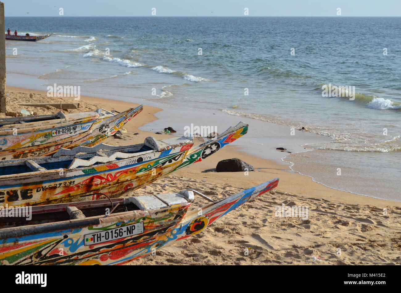 Artisanal wooden fishing boats (pirogues) in the Petite Côte, Senegal ...