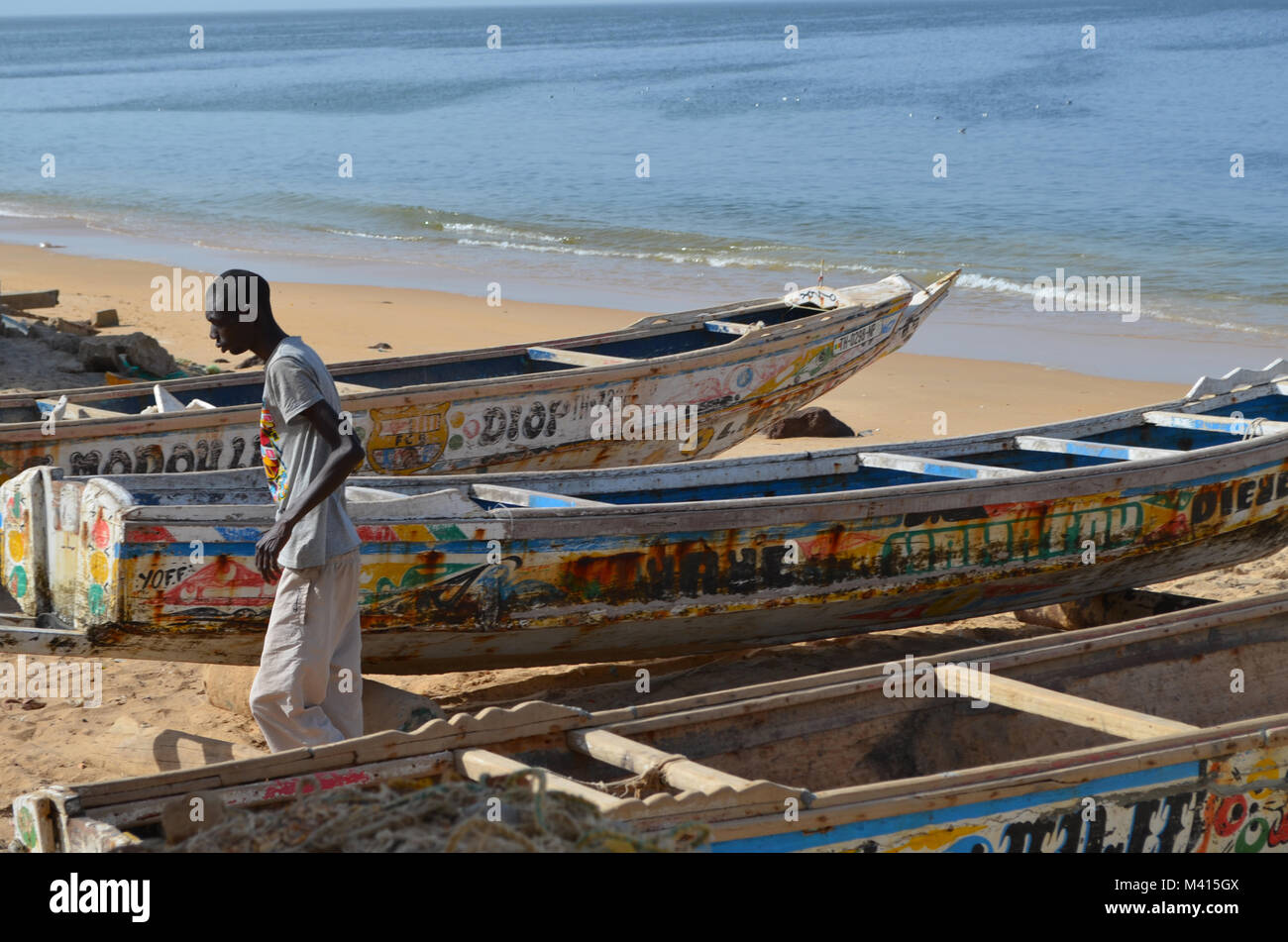 Artisanal wooden fishing boats (pirogues) in the Petite Côte, Senegal ...
