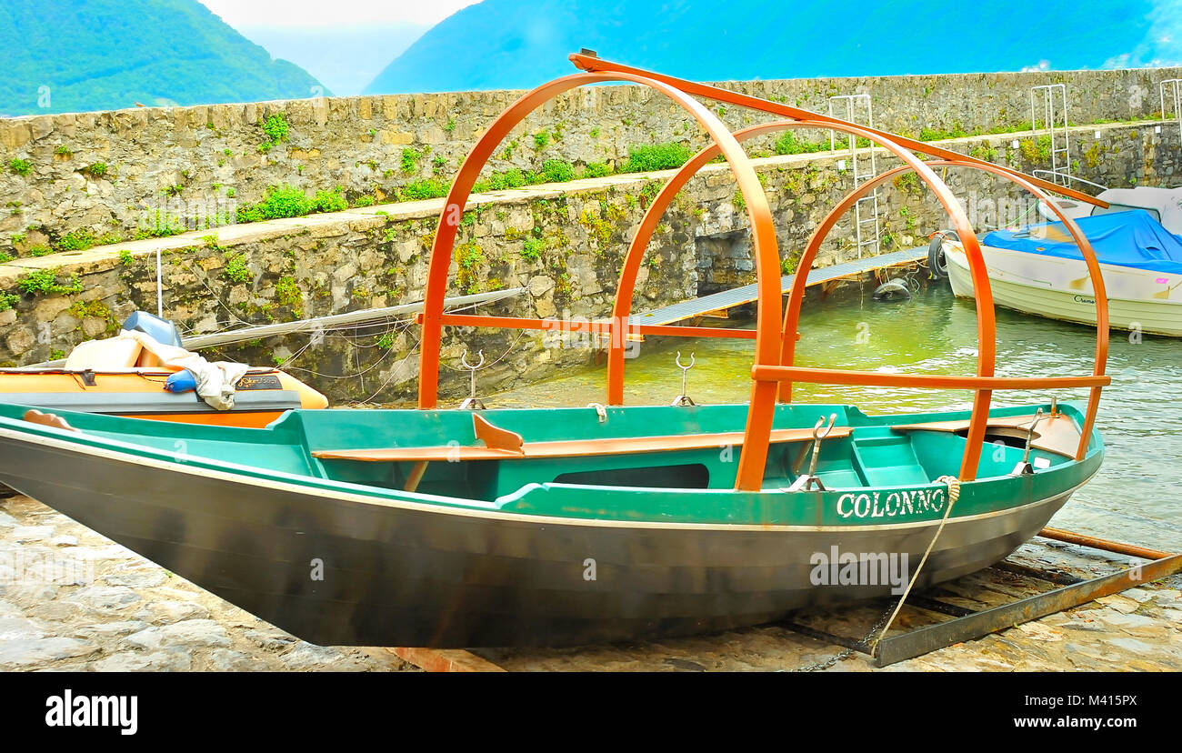 Traditional Italian Lucia fishing boat in the harbour at Colonno ...
