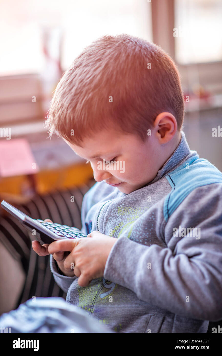 Boy math homework calculator hi-res stock photography and images - Alamy