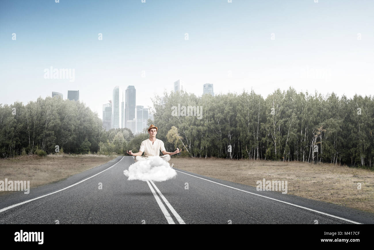 Young man keeping mind conscious Stock Photo - Alamy