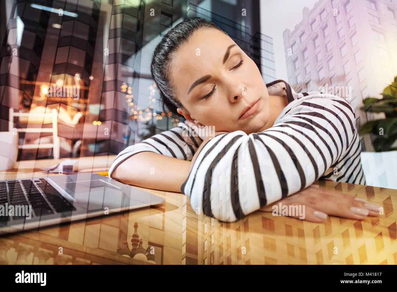 Tired employee having a short nap during her working day Stock Photo ...