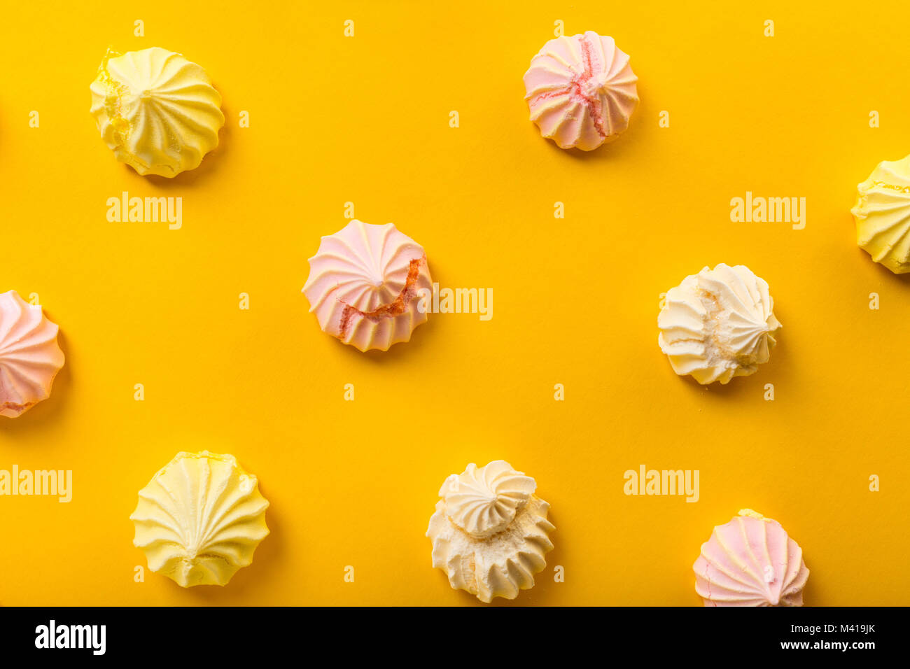 food background, dessert meringue on yellow Stock Photo - Alamy