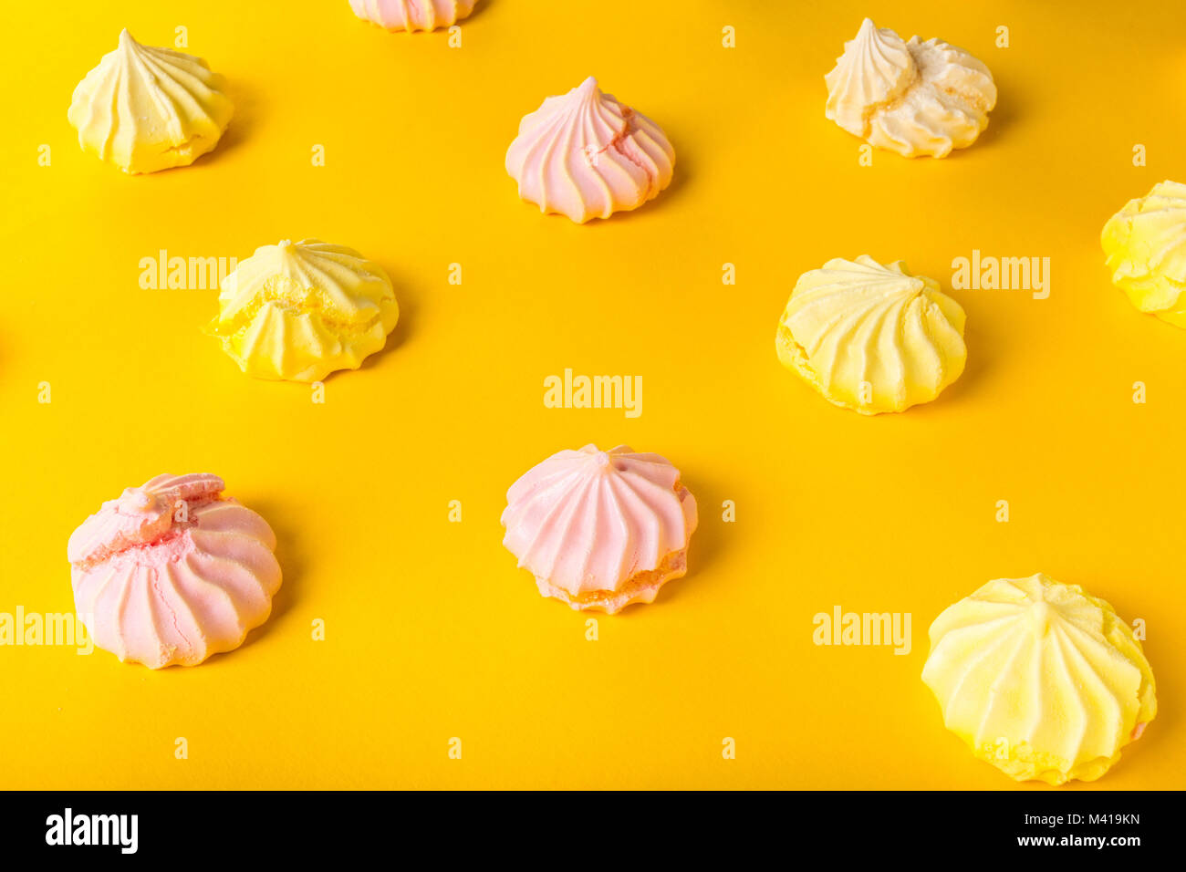 food background, dessert meringue on yellow Stock Photo - Alamy