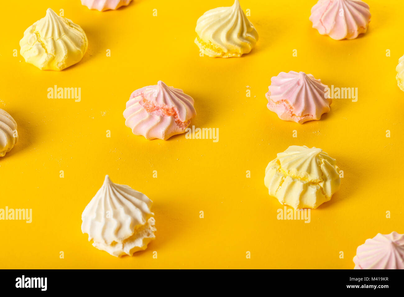 food background, dessert meringue on yellow Stock Photo - Alamy