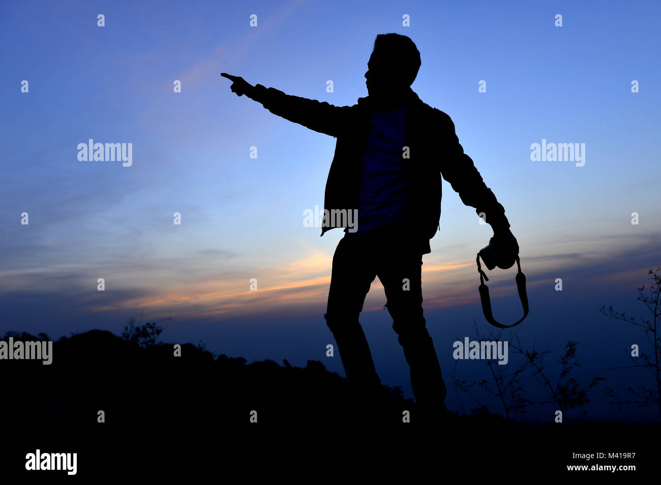 silhouette of freedom photographer action with camera in sun set time ...