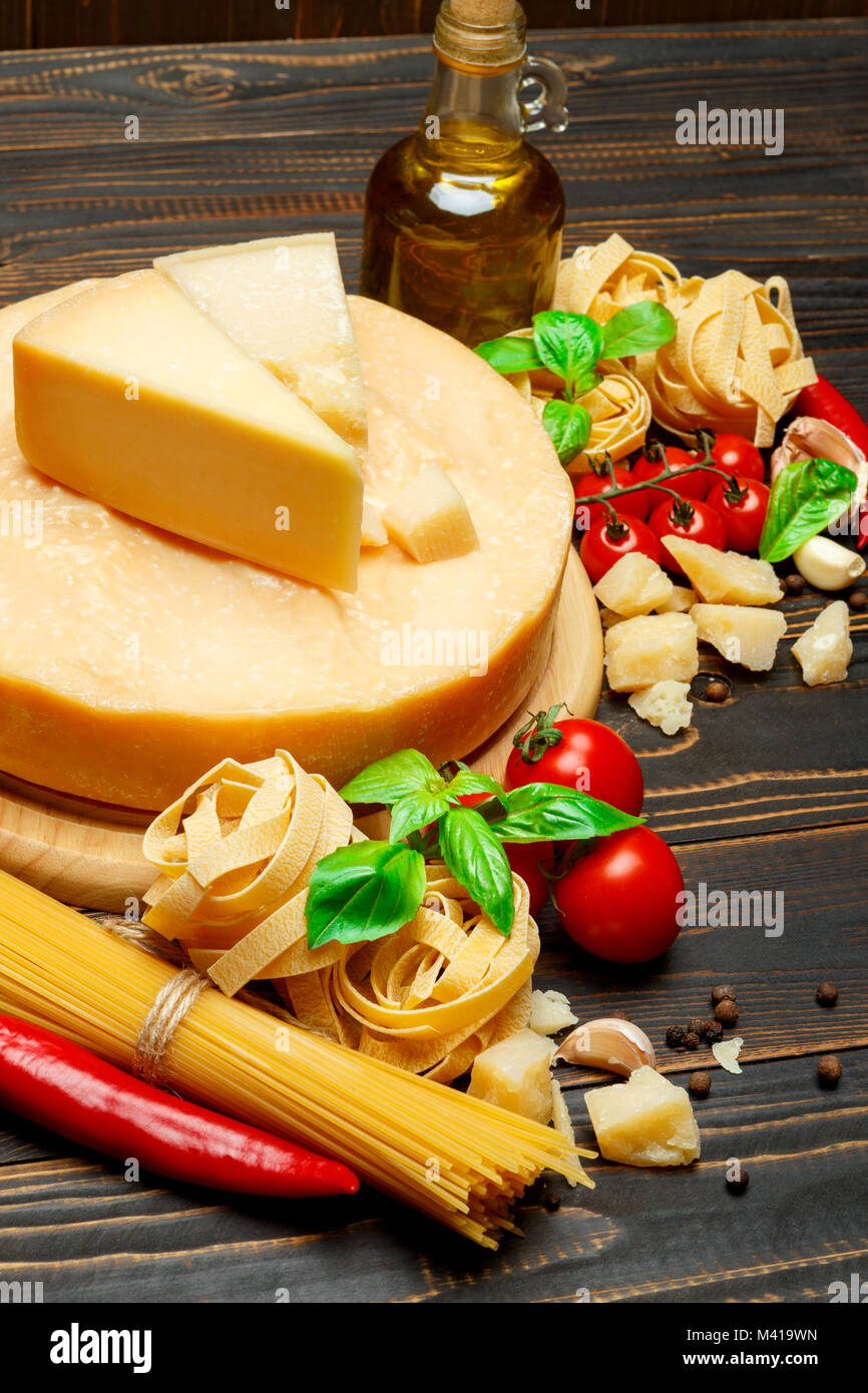 Traditional Italian parmesan or parmigiano cheese, pasta, tomatoes and ...