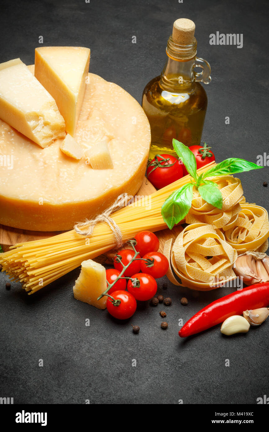 Traditional Italian parmesan or parmigiano cheese, pasta, tomatoes and ...