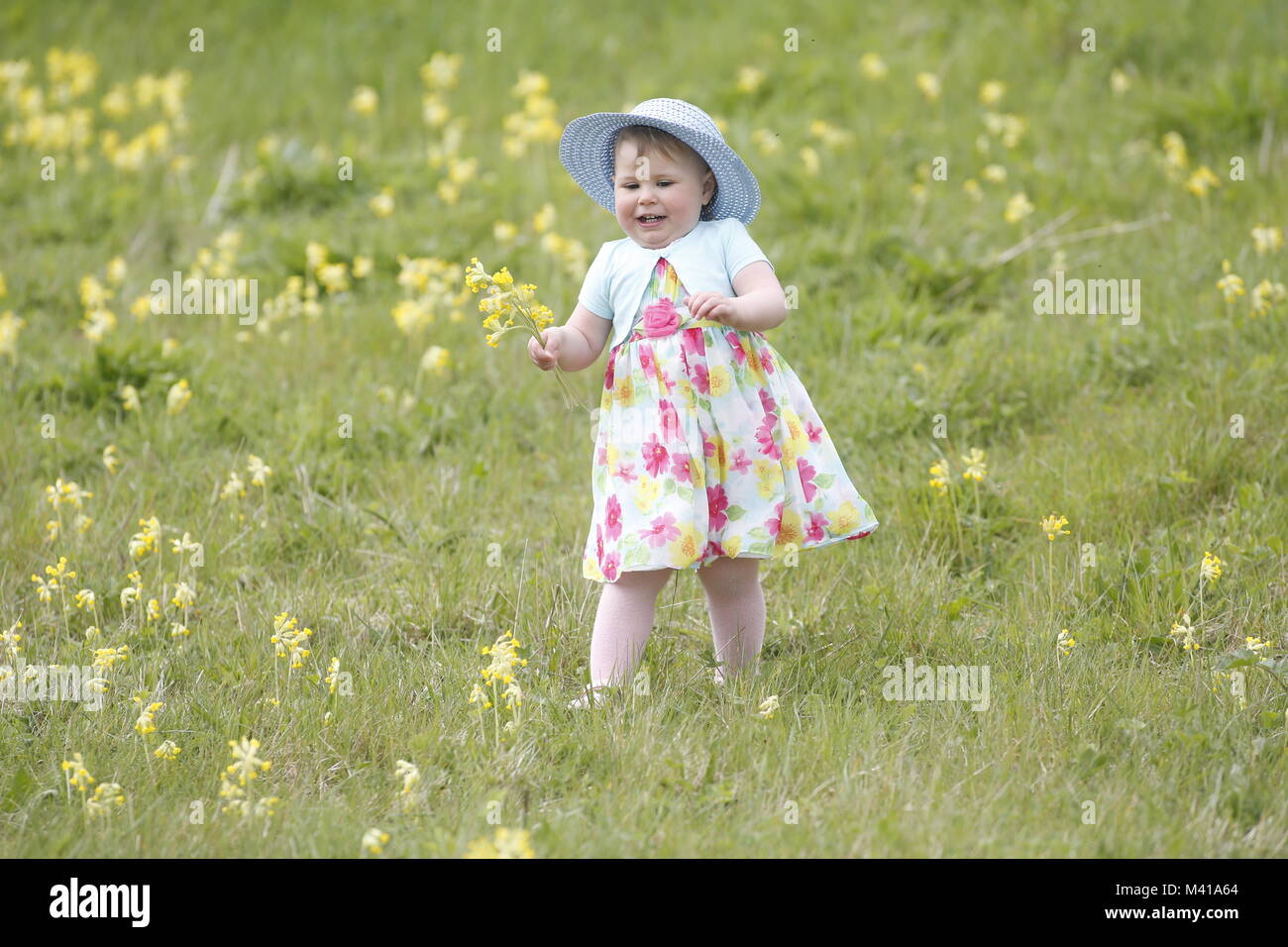Ivy Mitchell enjoys the Easter weather as she runs around the meadow ...