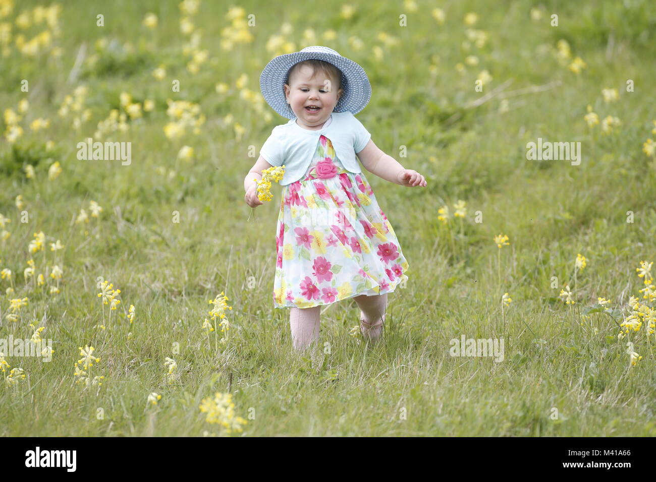 Ivy Mitchell enjoys the Easter weather as she runs around the meadow ...