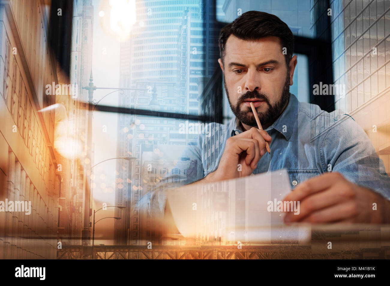 Concentrated person looking thoughtful while reading a letter Stock ... Concentrated person looking thoughtful while reading a letter Stock ...
