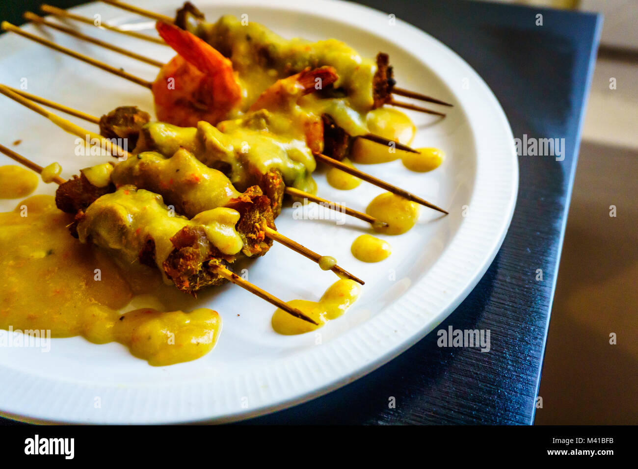 Satay, sate, or satti, is a dish of seasoned, skewered and grilled meat ...