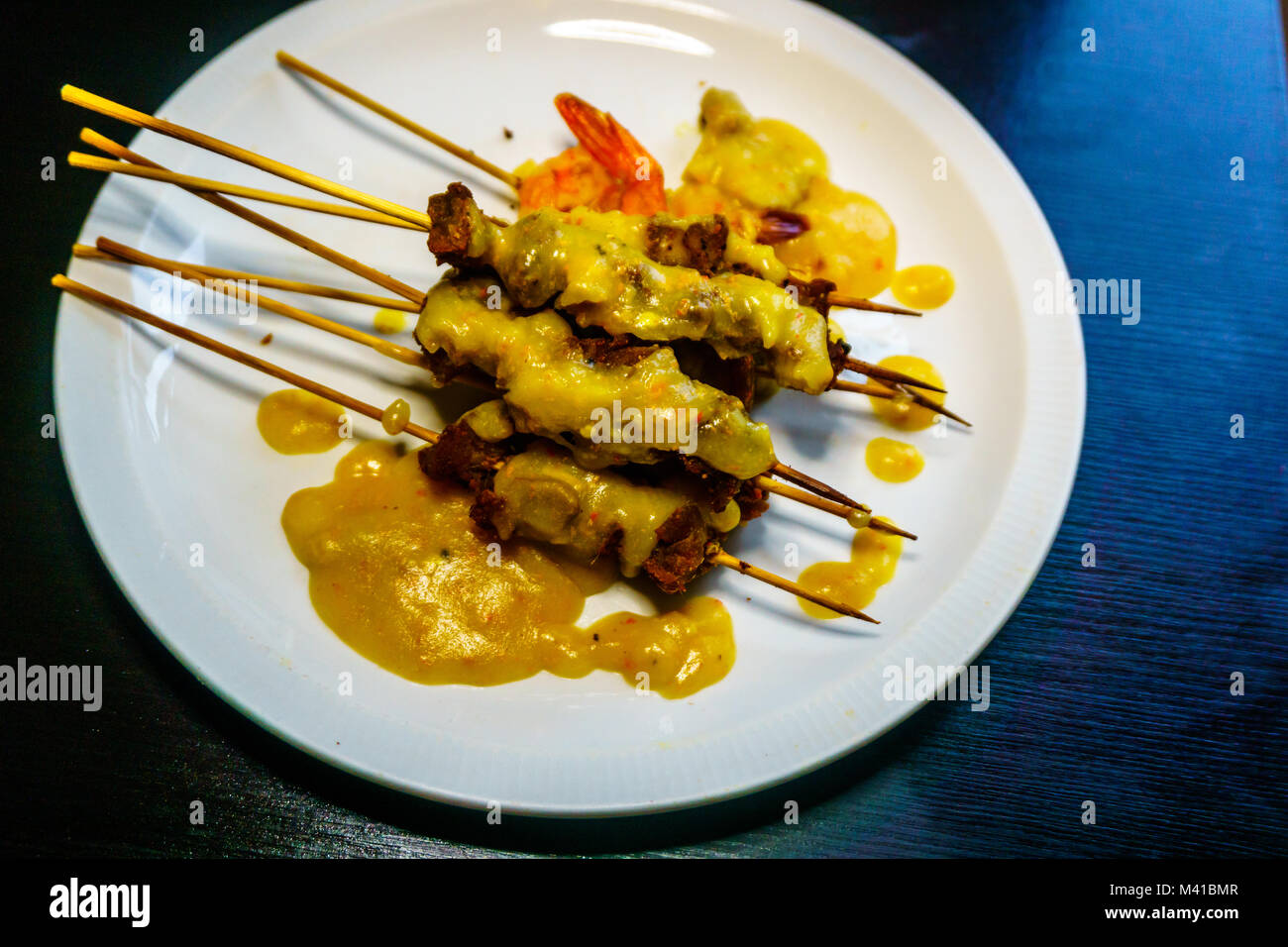 Satay, sate, or satti, is a dish of seasoned, skewered and grilled meat ...