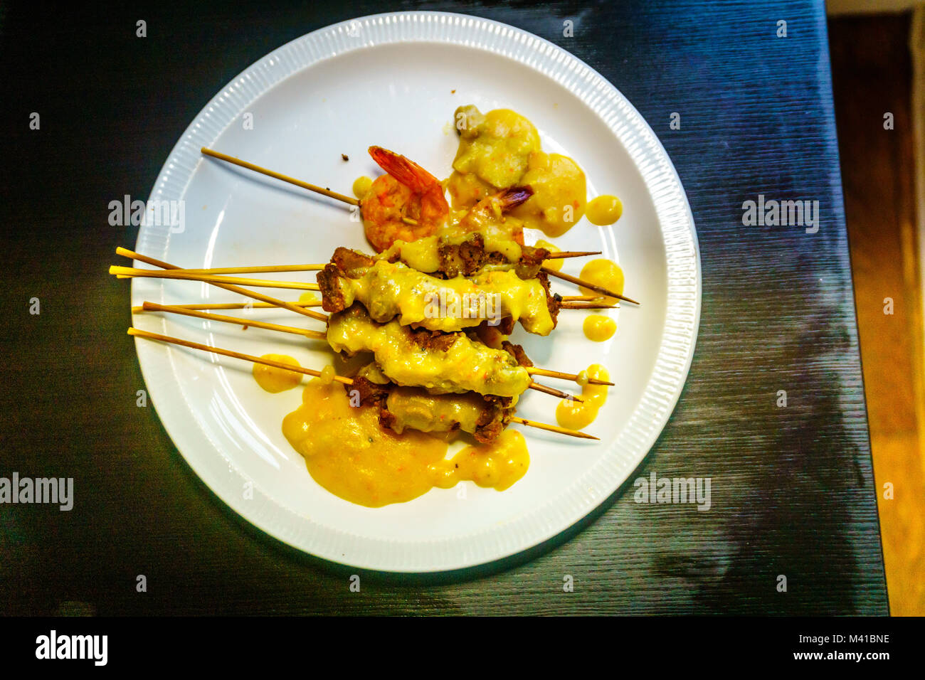Satay, sate, or satti, is a dish of seasoned, skewered and grilled meat ...
