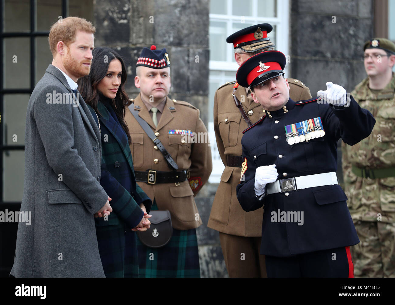 Prince Harry and Meghan Markle meet Sgt David Beveridge (right) before ...