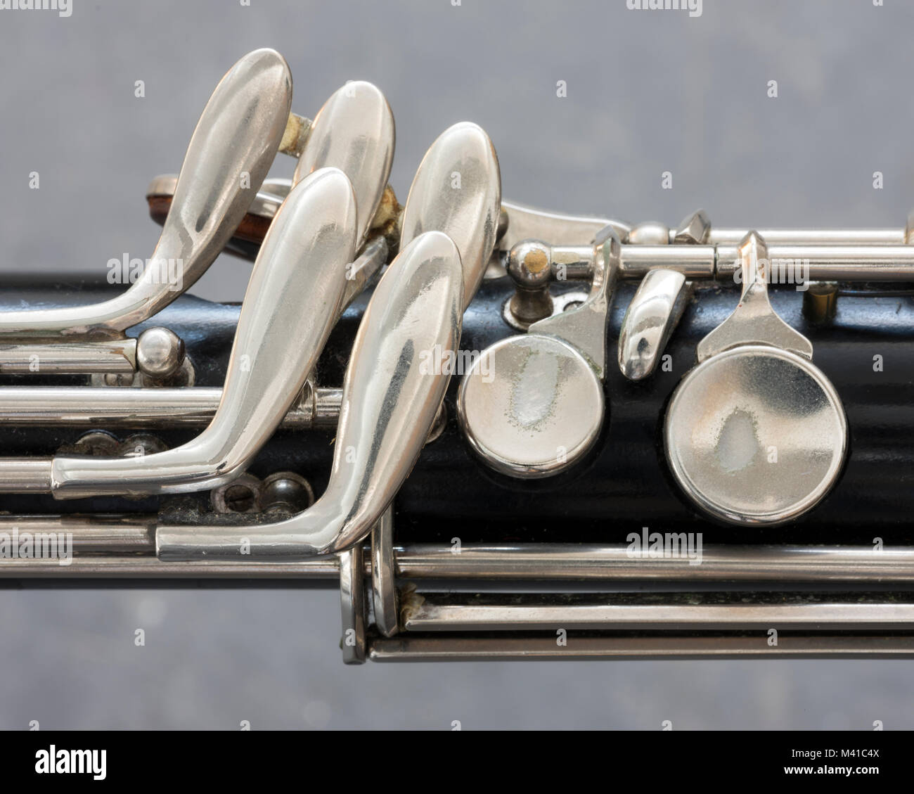 closeup of part of bass clarinet with grey background Stock Photo - Alamy