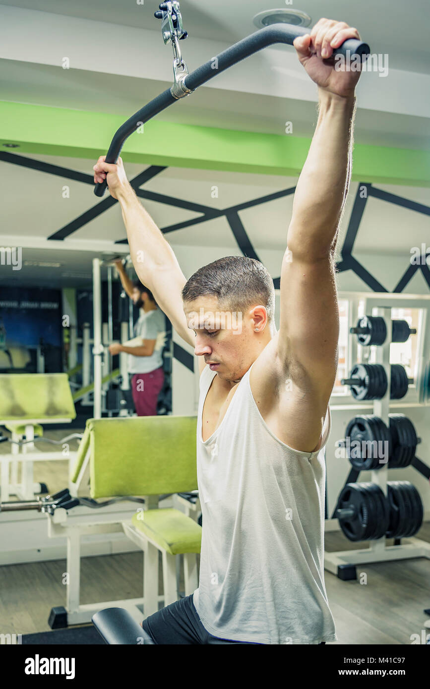 Man using chest exercise machine hi-res stock photography and images ...