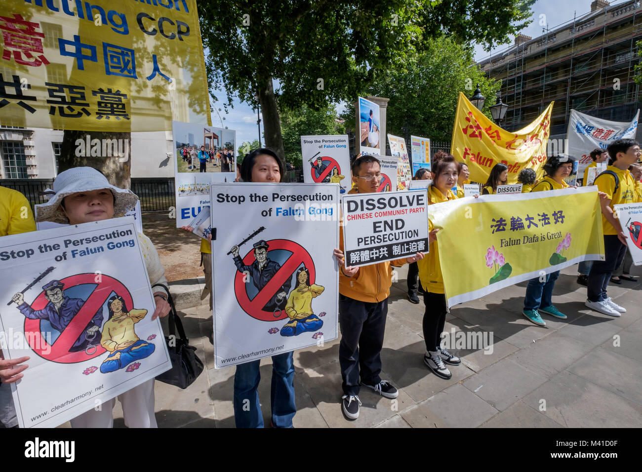 Protesters hold posters and banners callinf for an end to the ...