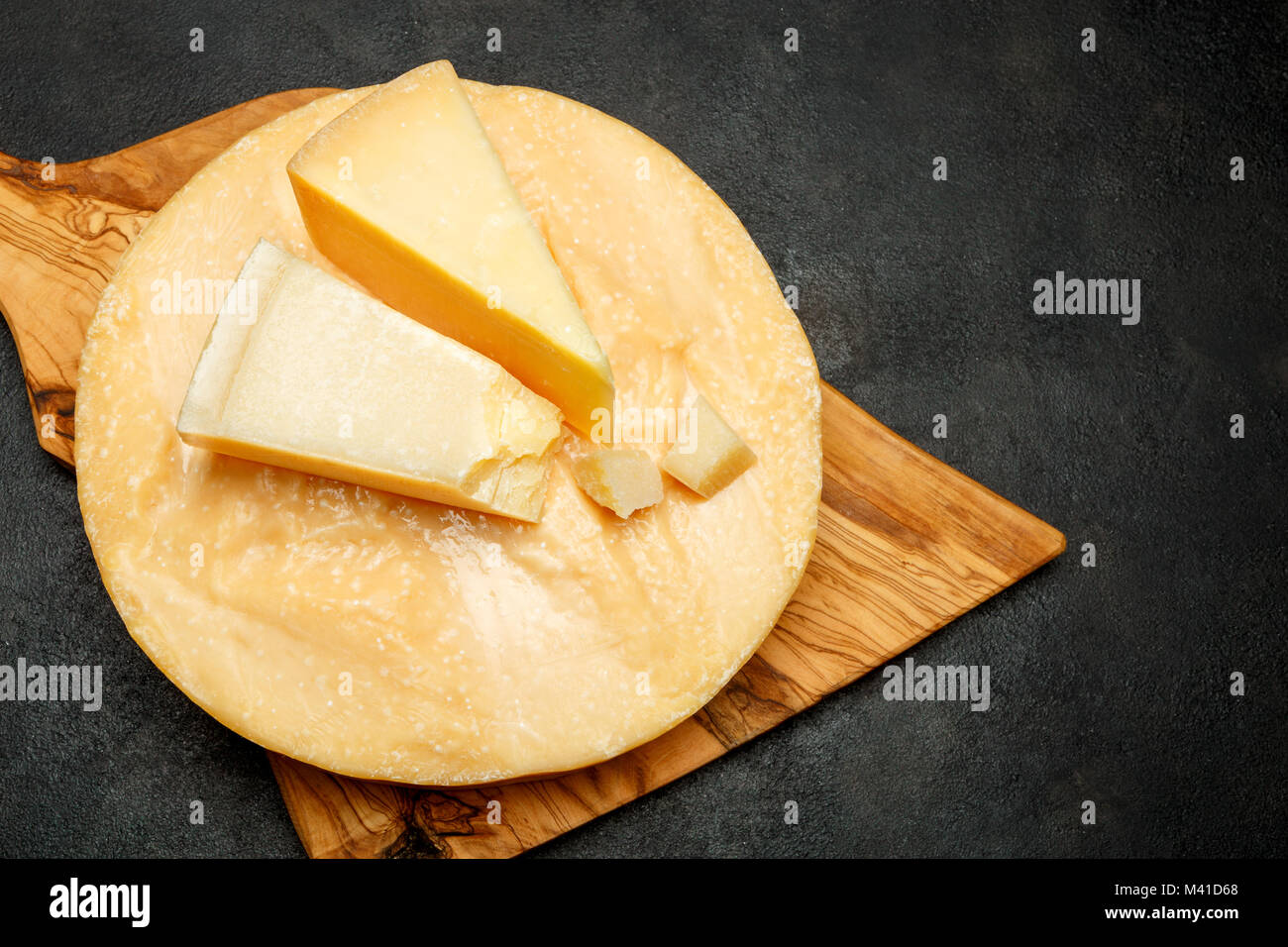 Whole round Head of parmesan or parmigiano hard cheese on concrete ...