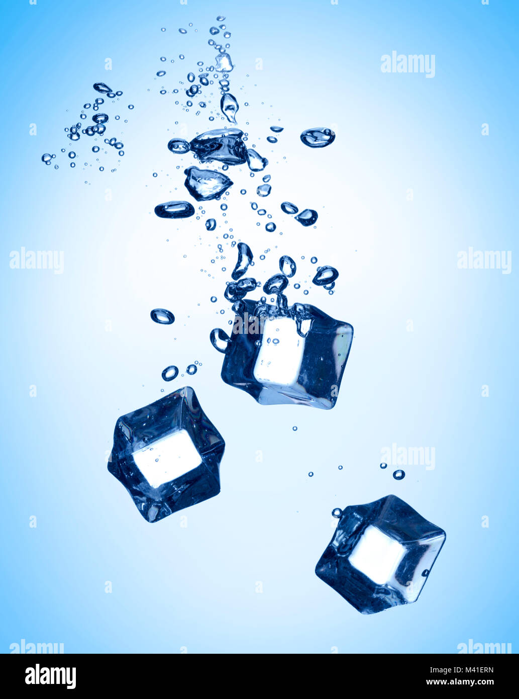 close up of ice cube splash in water on white background Stock Photo - Alamy
