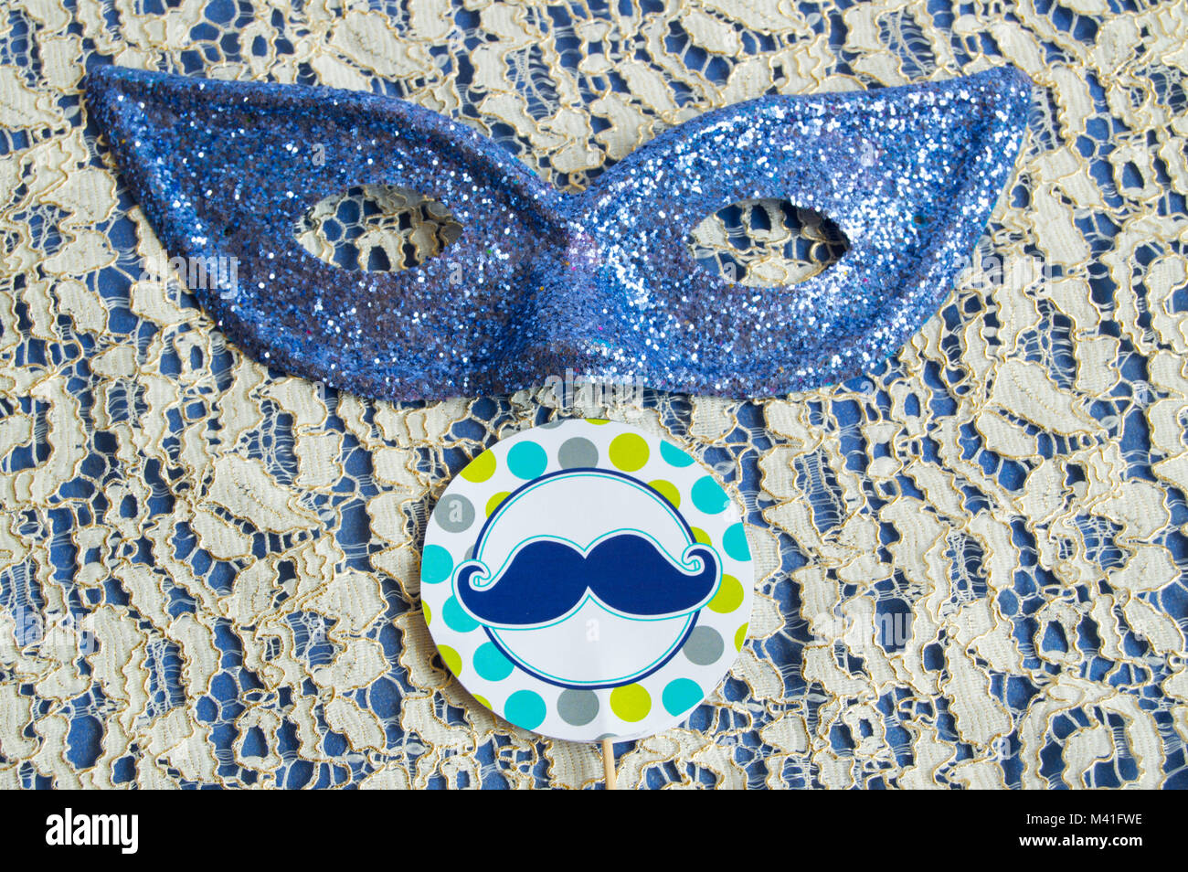 carnival mask painted with a moustache lying on the lace Stock Photo ...