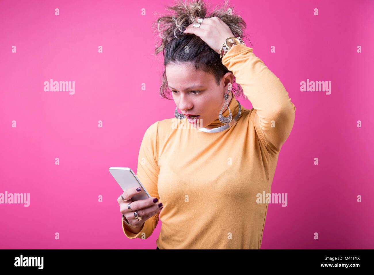 Shocking news, young woman, pink background Stock Photo - Alamy Shocking news, young woman, pink background Stock Photo - Alamy