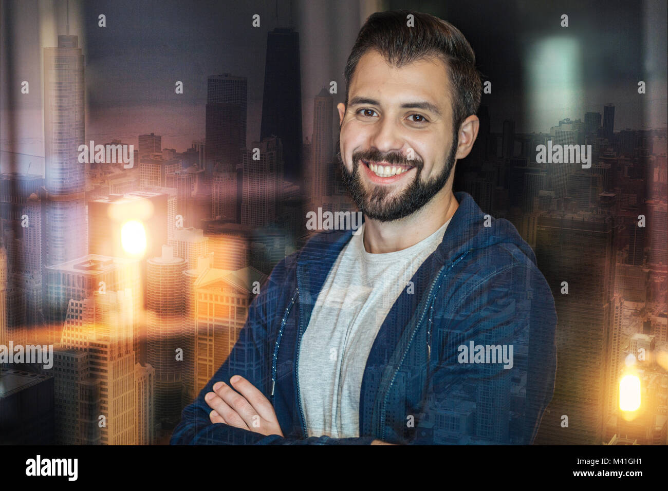 Pleased man crossed arms hi-res stock photography and images - Alamy