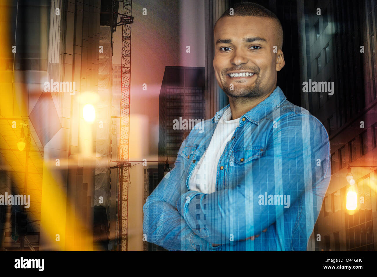 Positive man smiling while relaxing after his working day Stock Photo ...