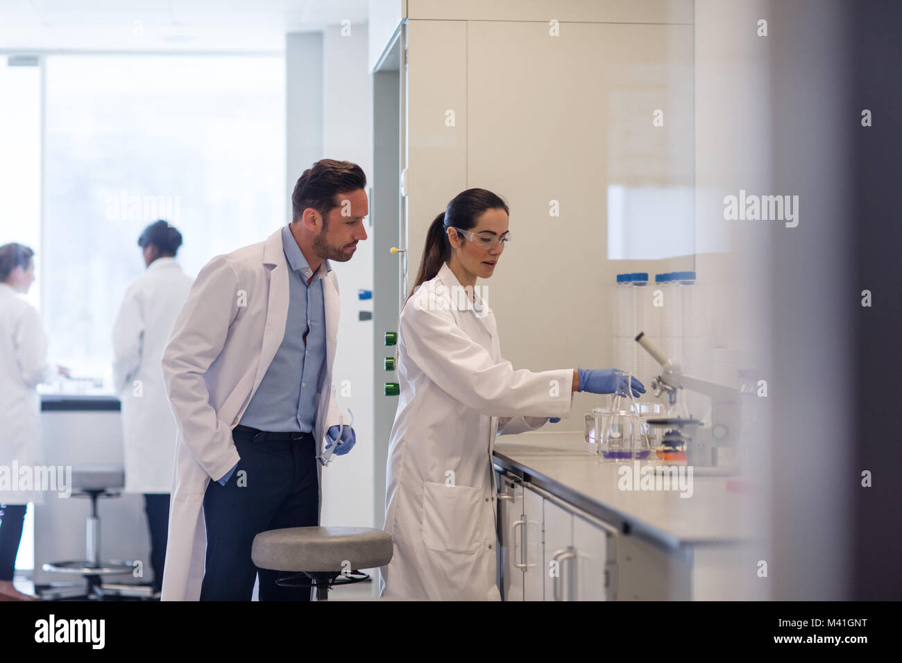 Female student scientist working on an experiment Stock Photo - Alamy