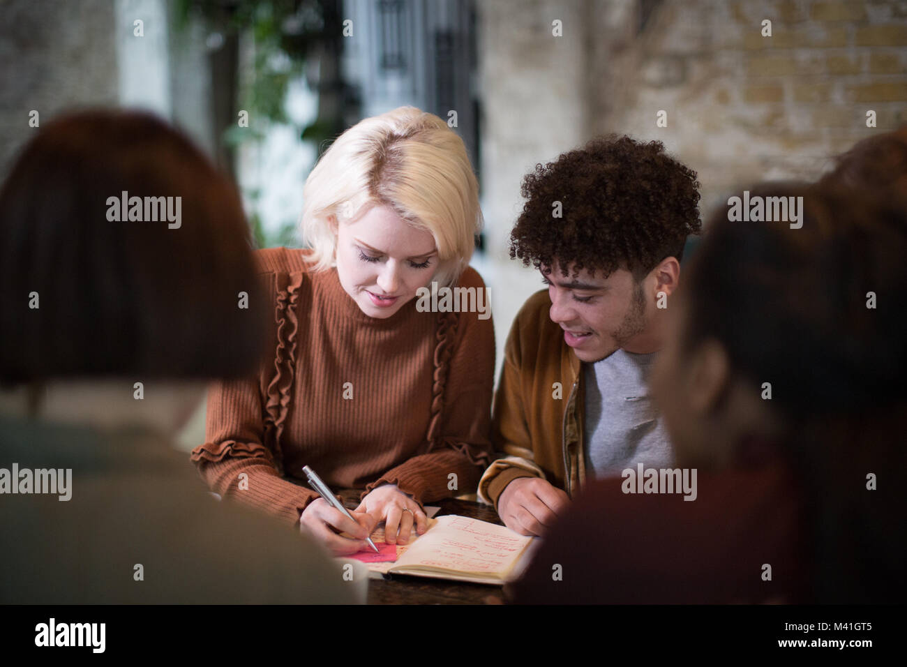 Group of young entrepreneurs working together Stock Photo - Alamy