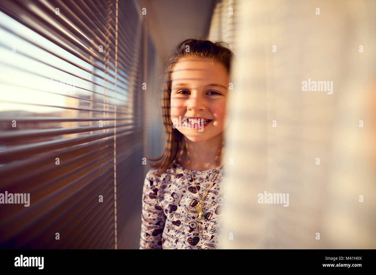 Girl hidden behind a curtain hi-res stock photography and images - Alamy