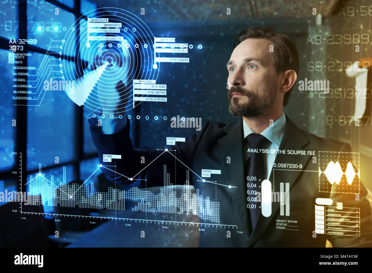 Serious concentrated programmer looking at the transparent screen Stock ...