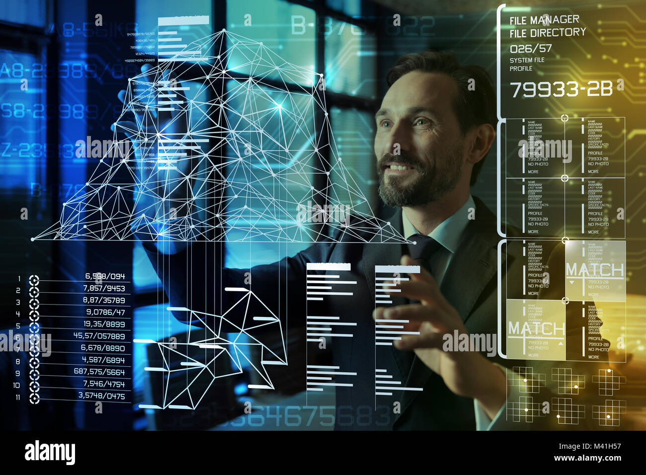 Clever programmer standing in front of his device and touching the screen Stock Photo - Alamy