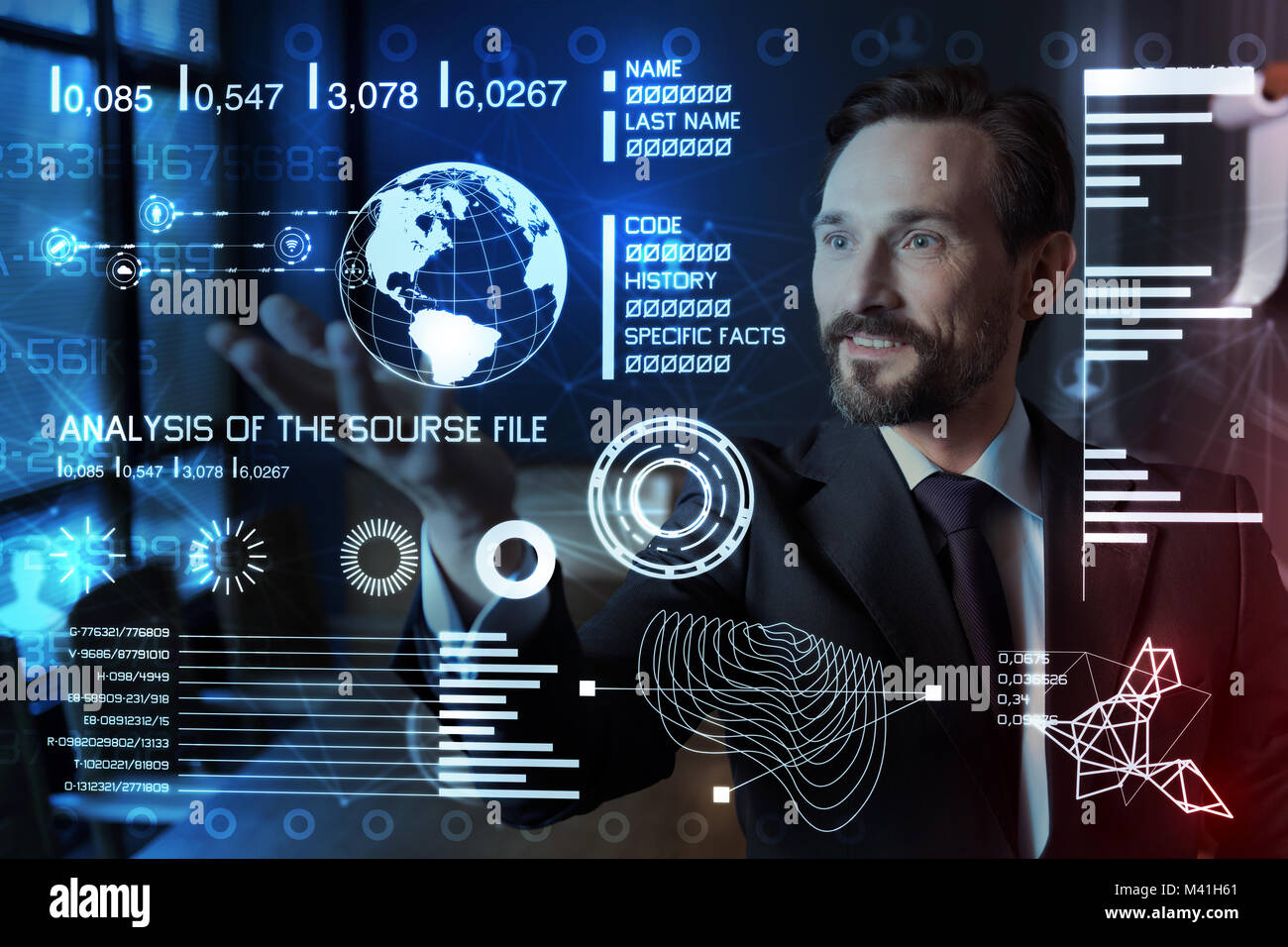 Happy man admiring the futuristic technologies while working Stock ...