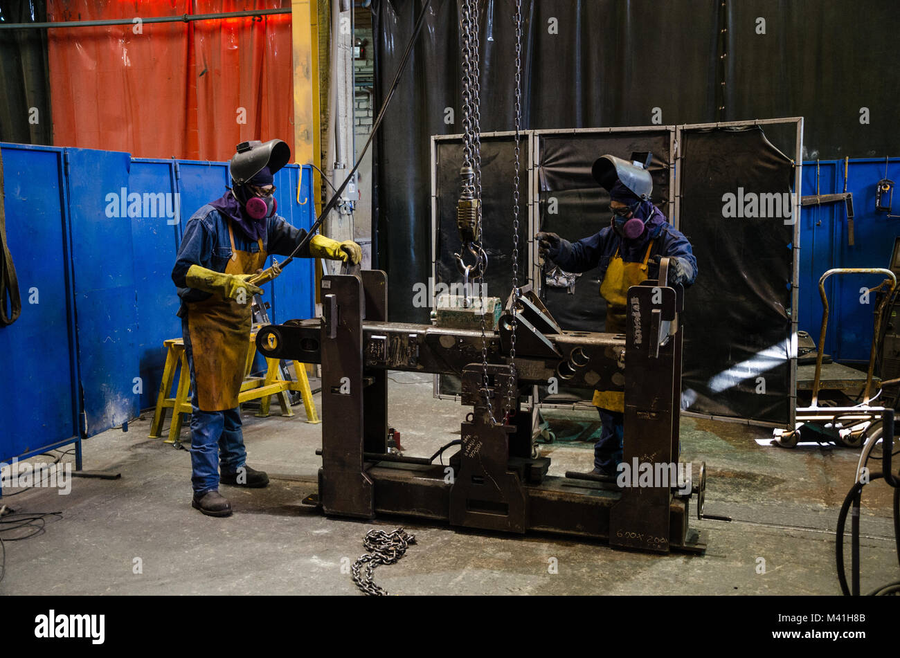 Machinist moving heavy structures Stock Photo - Alamy