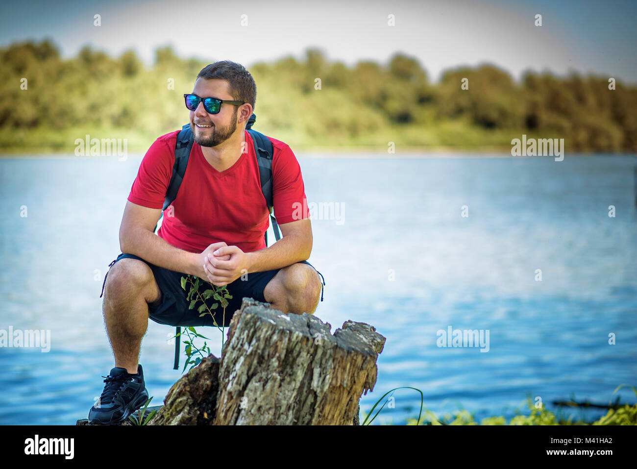 Man smiling next river hi-res stock photography and images - Alamy