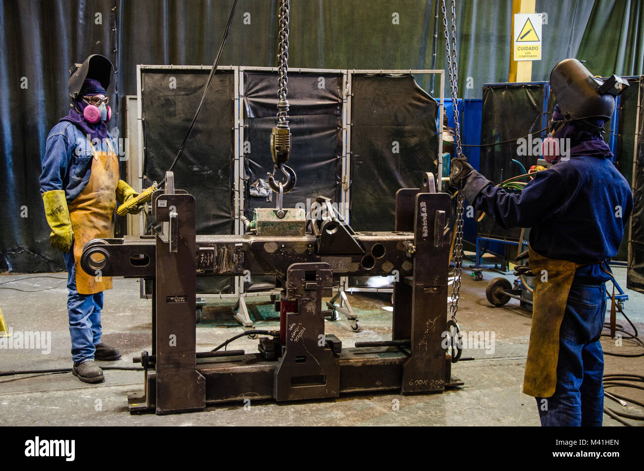 Machinist moving heavy structures Stock Photo - Alamy