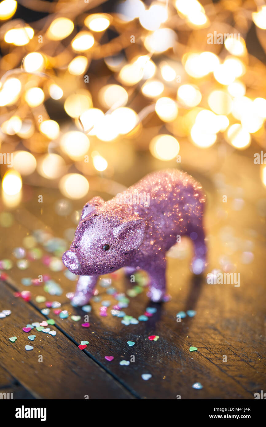 Lucky charm, little pink pig in front of unfocused lights Stock Photo ...