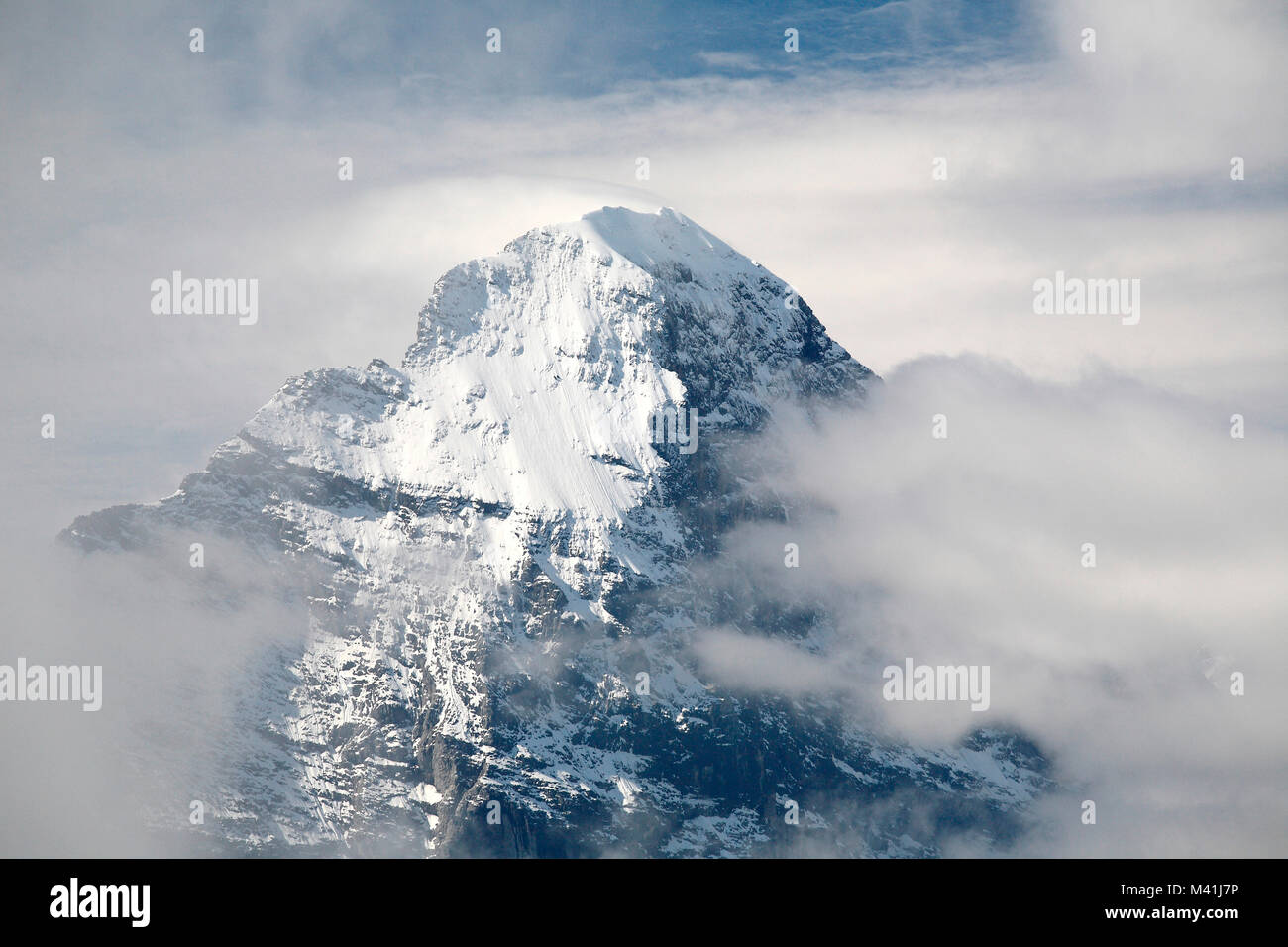 The summit of Eiger, over the clouds. Bernese Oberland, Switzerland ...