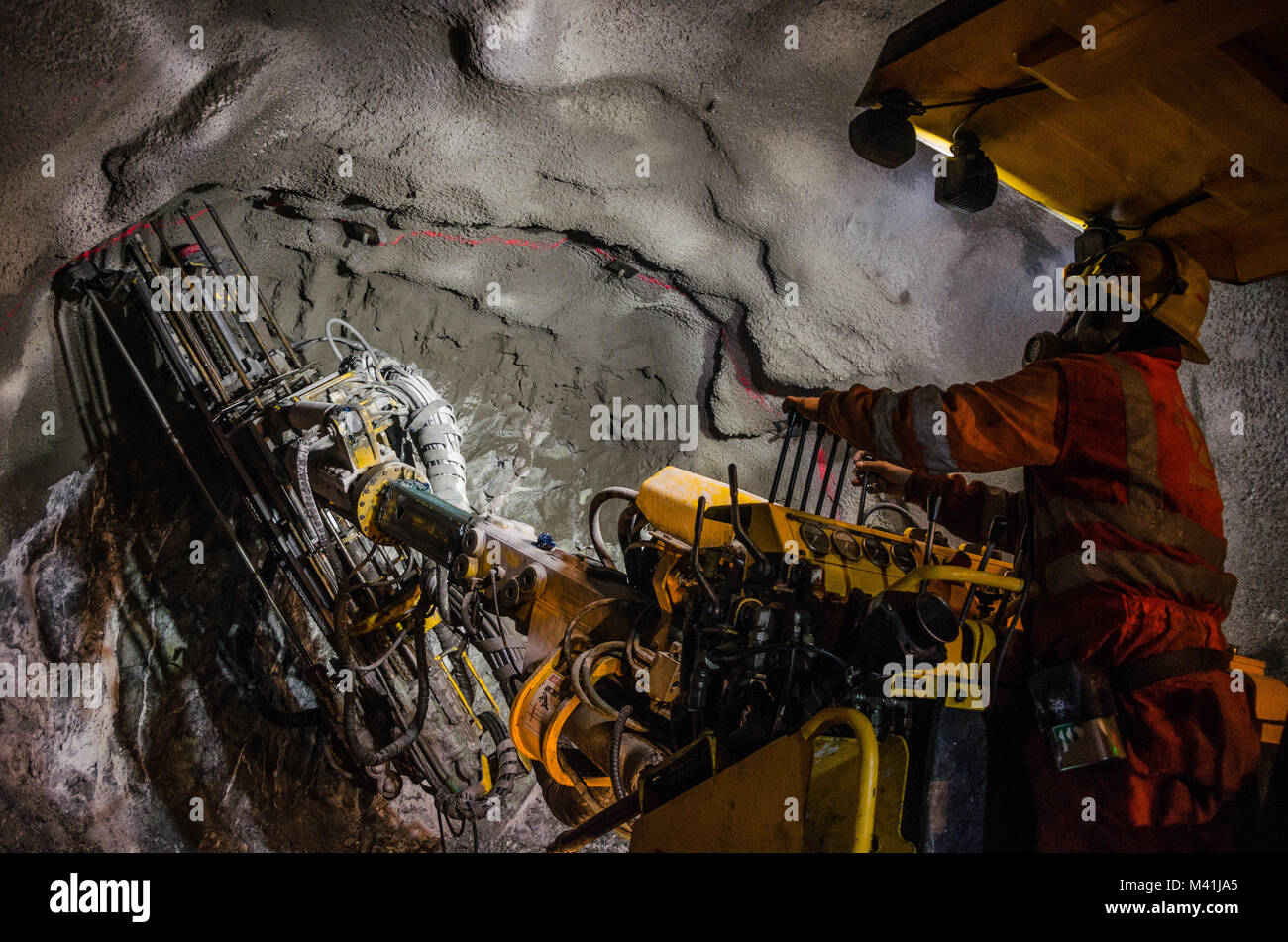 Mining machine arm drilling minerals Stock Photo - Alamy