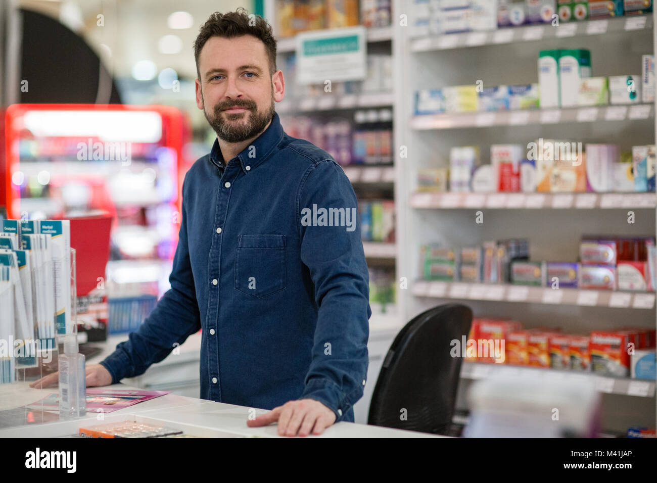 Portrait of pharmacist in store Stock Photo - Alamy
