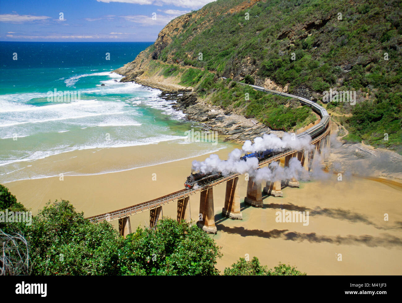 South Africa. Wilderness. Steam train on bridge called Kaaimans Bridge ...
