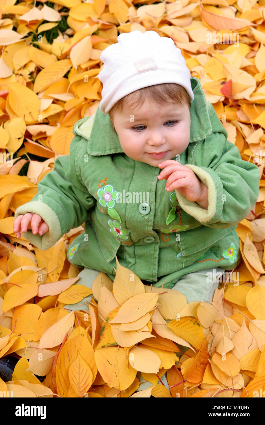 baby at a park in Autumn Stock Photo - Alamy