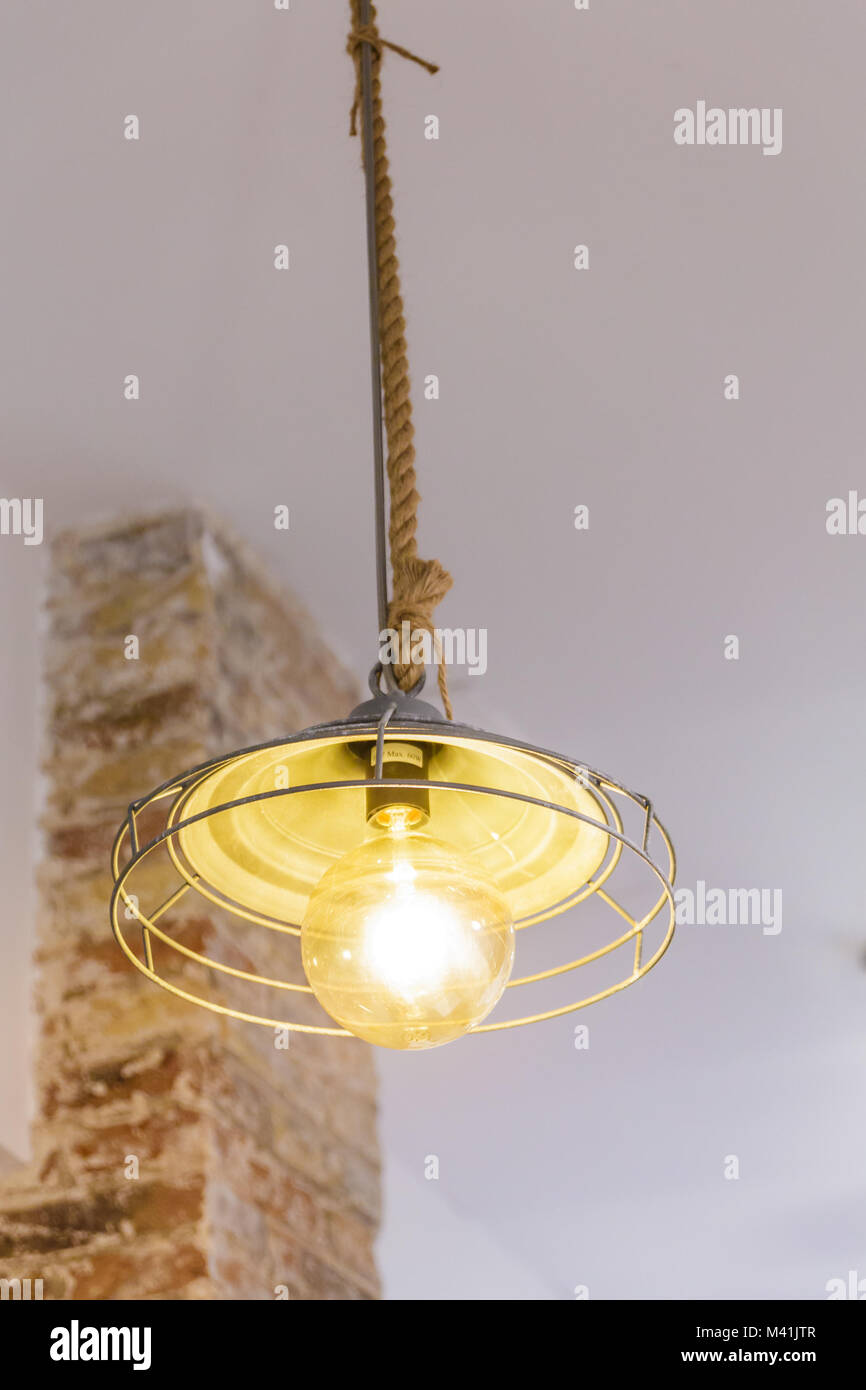 Old Light Fixture Hung by Rope in Commercial Building Stock Photo - Alamy