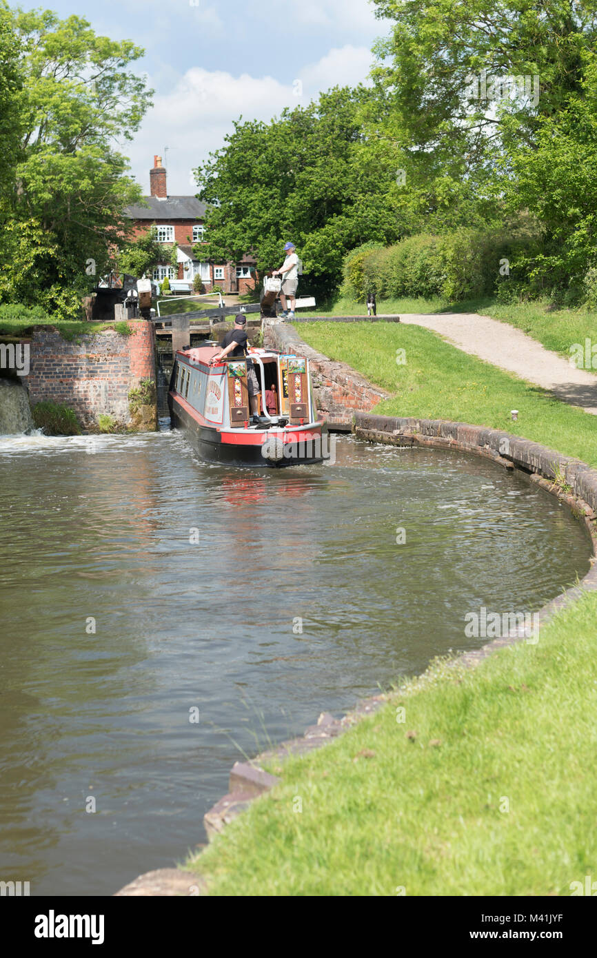 Narrow boat negotiating the Lapworth Lock flight, North Stratford Canal ...