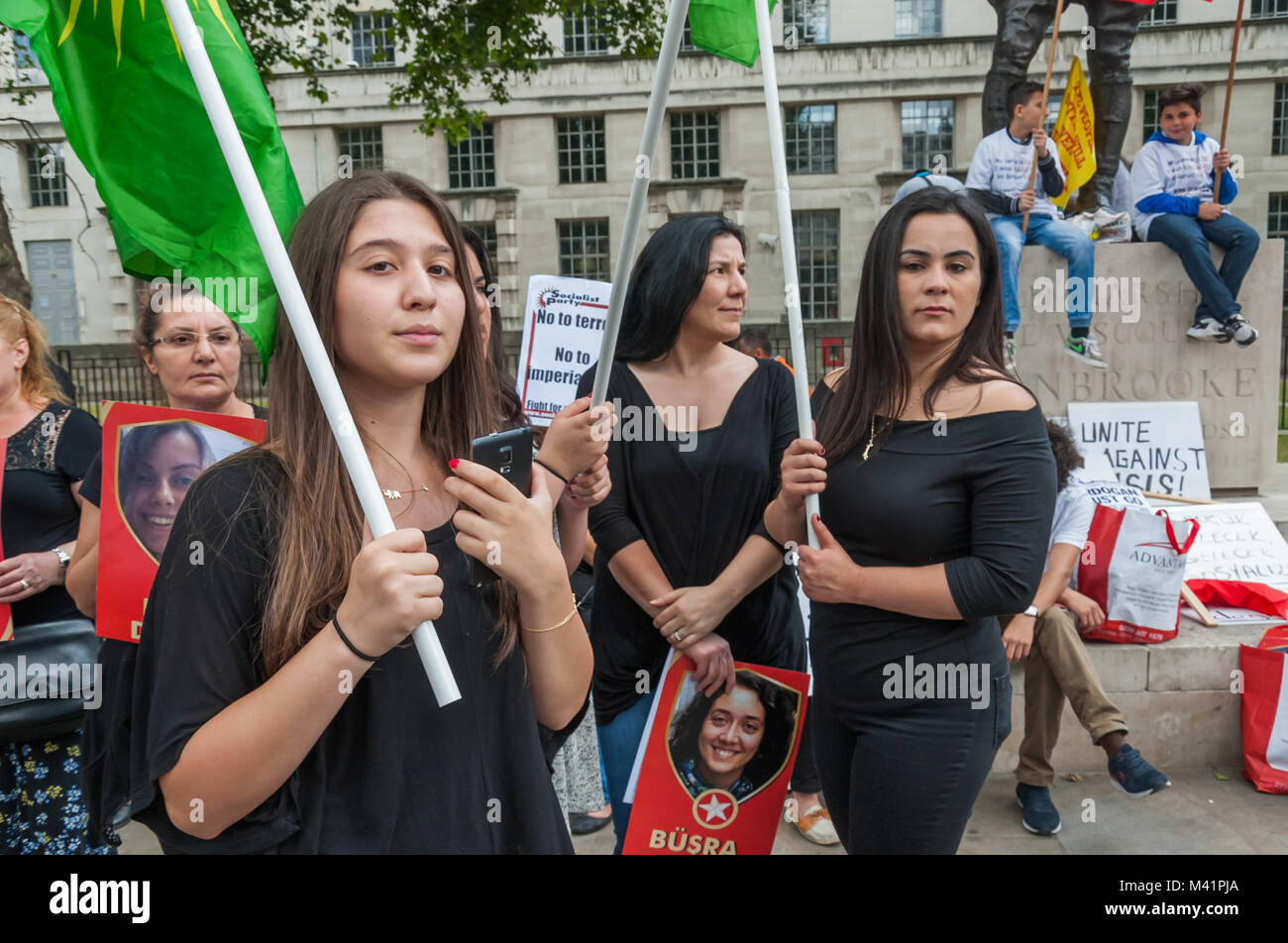 Women in black at the protest at Downing St over the massacre at Suruc ...
