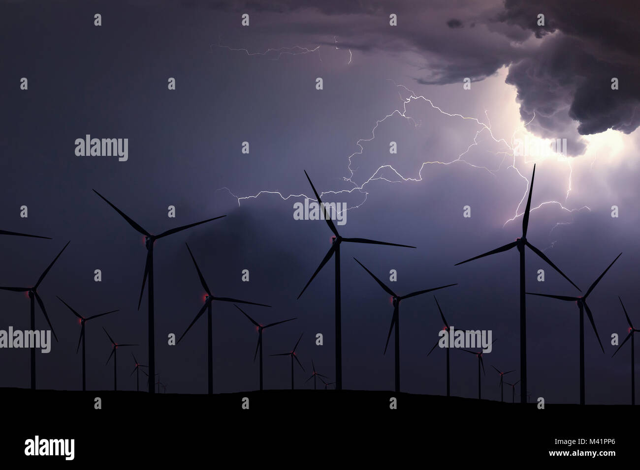 Storm Night Over Wind Farm. Energy and nature Night Sky Stock Photo - Alamy