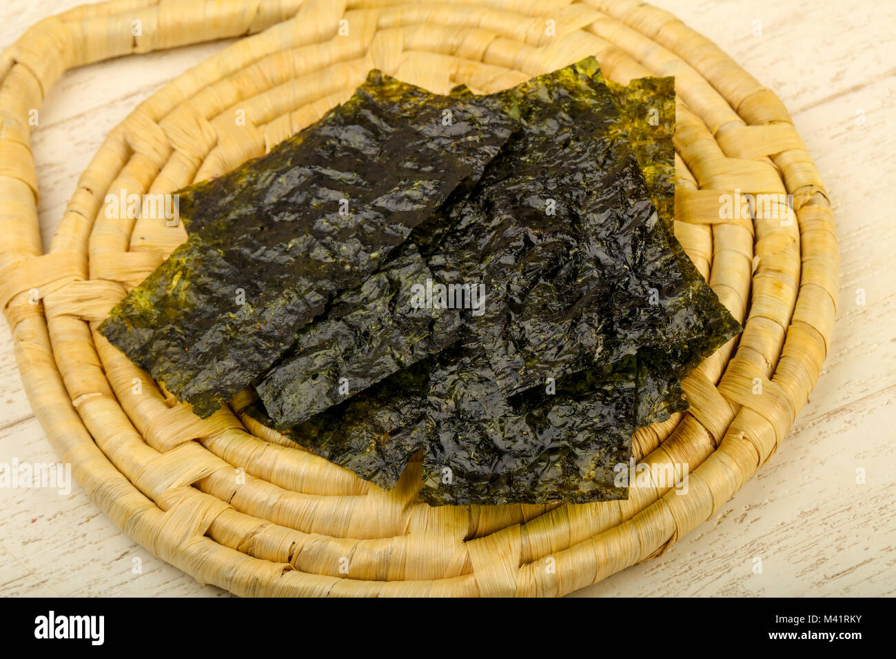 Crispy Nori sheets chips over wooden background Stock Photo - Alamy