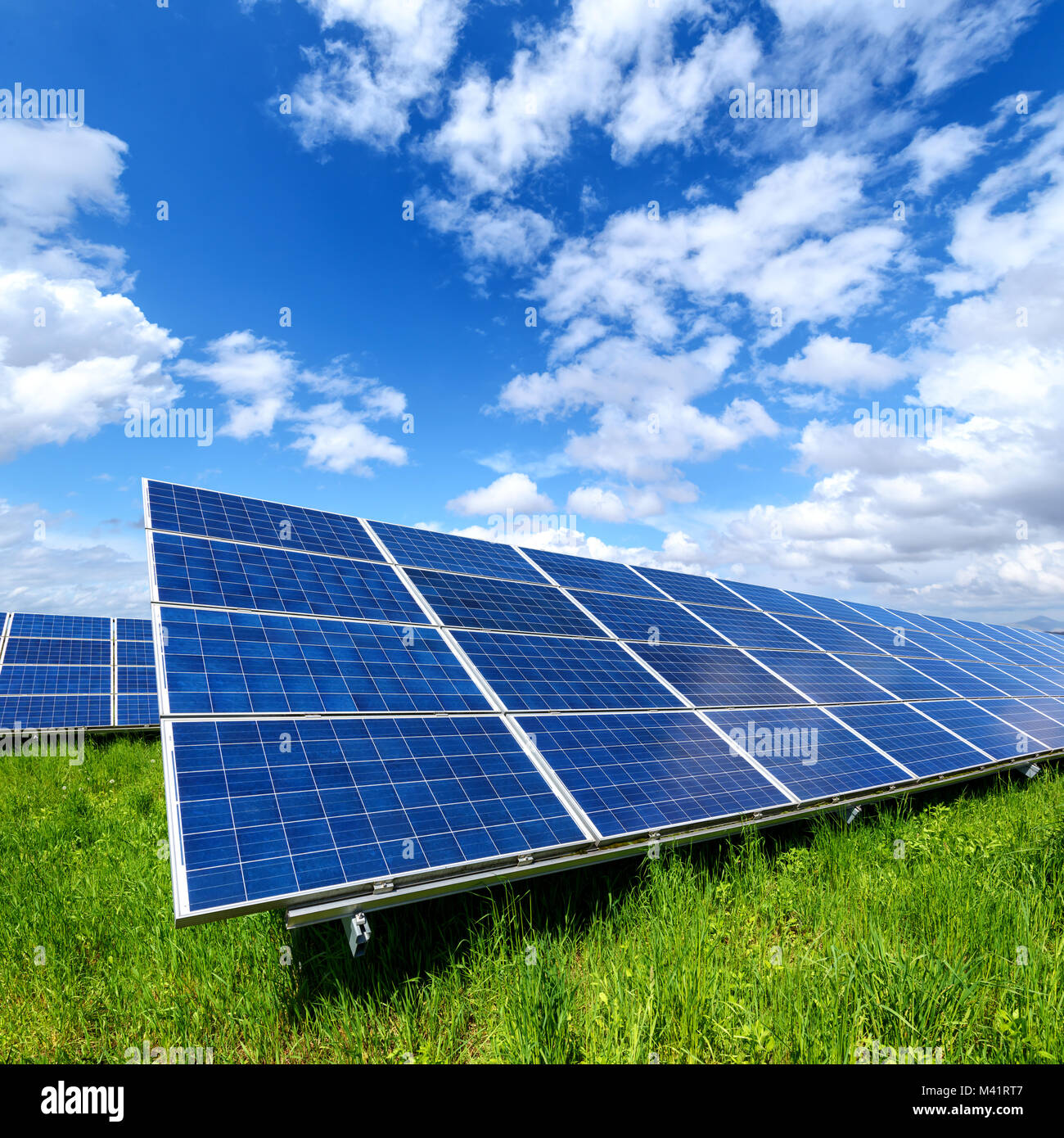 Solar panel on blue sky background Stock Photo - Alamy