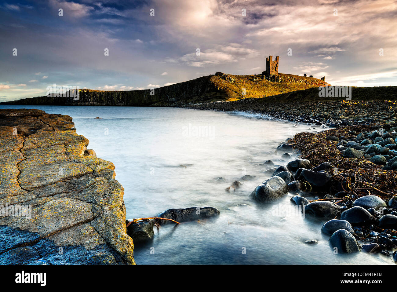 A photograph of Dunstanburgh Castle in Northumberland Stock Photo - Alamy